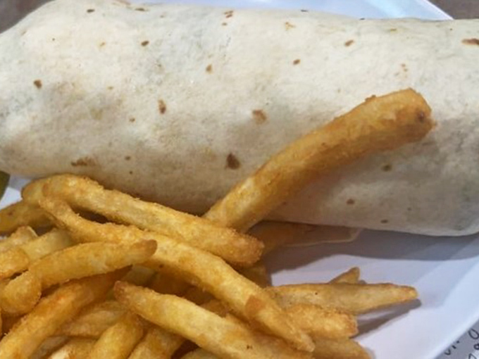 Breakfast knows no time constraints at Mike's Place, where this burrito stands ready to rescue you from hunger at any hour of the day.