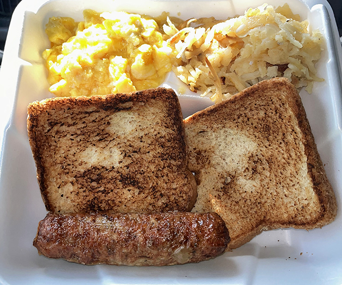 Breakfast doesn't get more honest than this: perfectly toasted bread, sausage with character, and eggs with hash browns that mean business.