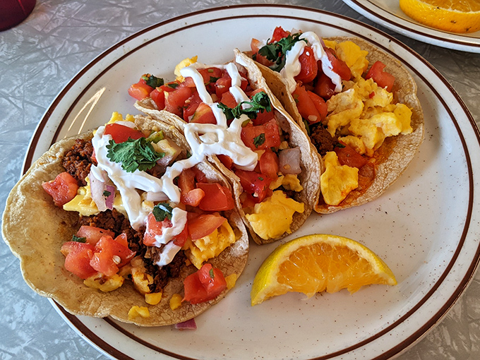 These breakfast tacos arrive dressed to impress with fresh pico and scrambled eggs that know how to party.