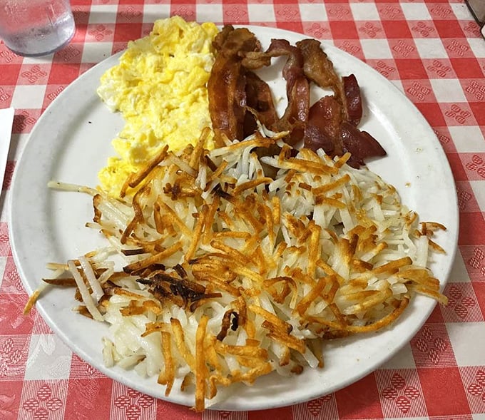 Breakfast perfection doesn't need fancy plating. Those hash browns have achieved the golden-crisp exterior that breakfast dreams are made of.