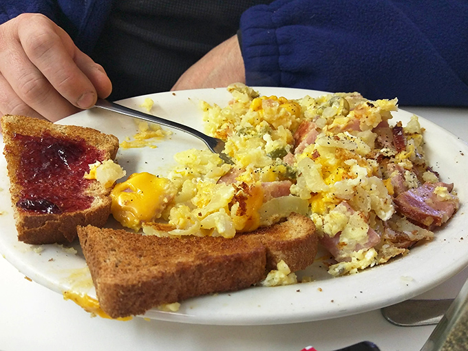 Breakfast doesn't get more honest than this&mdash;eggs scrambled with ham and cheese, paired with toast that's actually toasted properly.