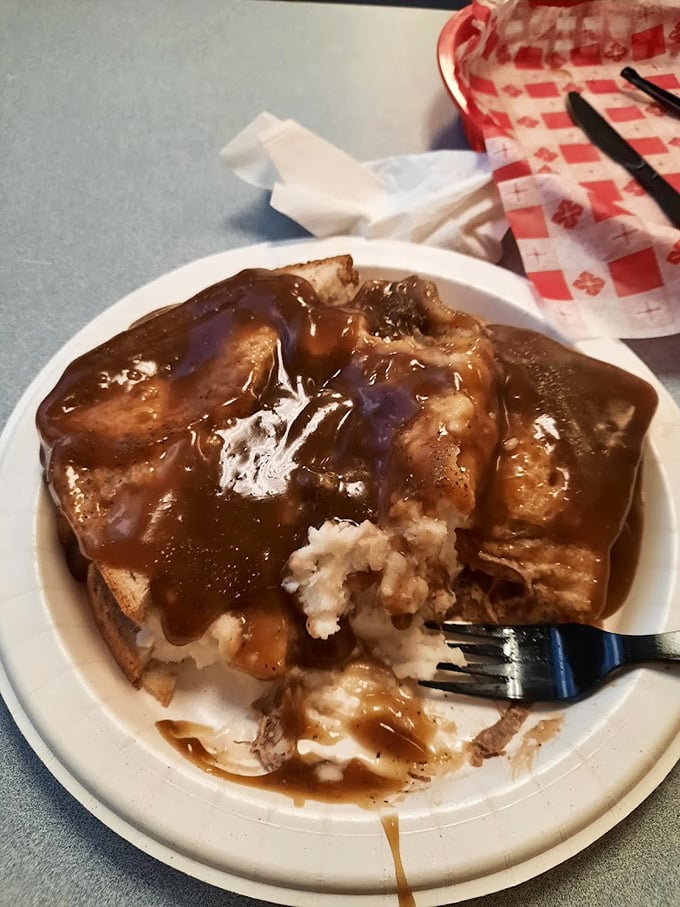 The hot brisket drowning in rich gravy atop mashed potatoes – Midwestern comfort on a plate.