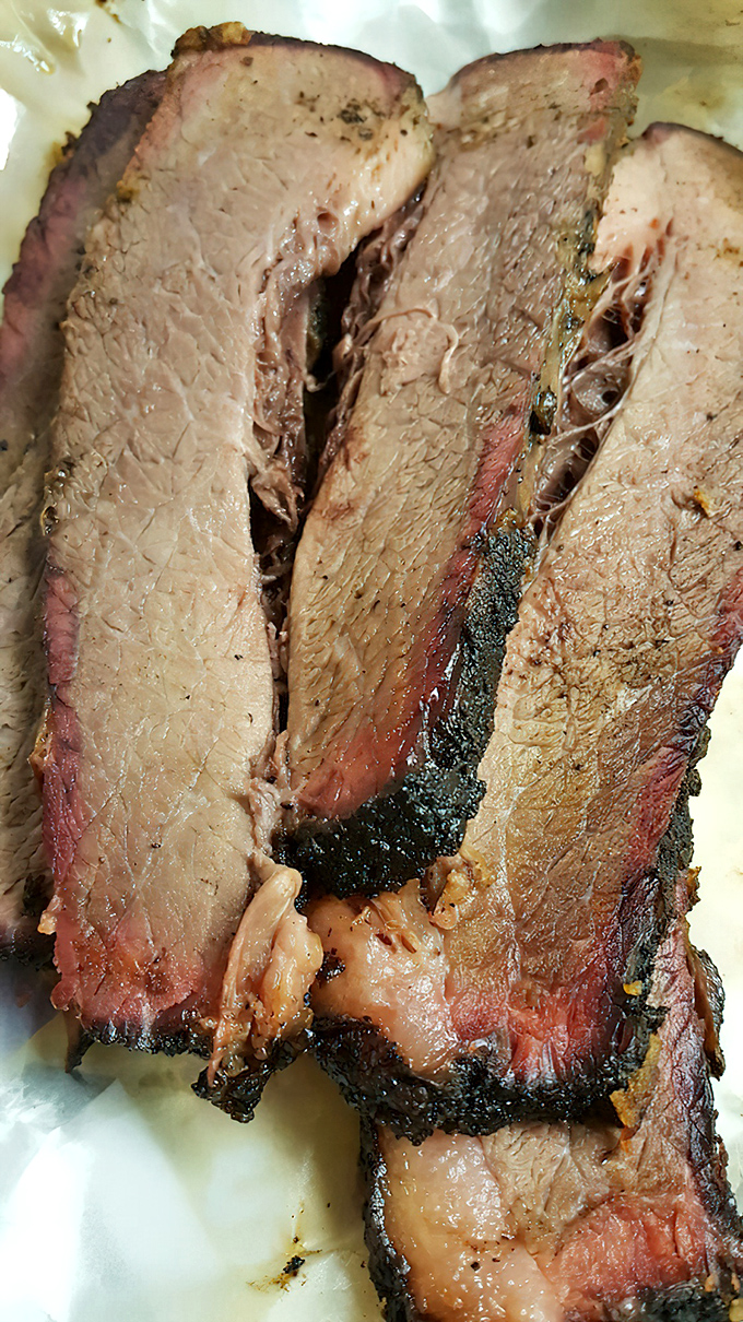 Brisket with that telltale pink smoke ring&mdash;the barbecue equivalent of a Rolex watch. Except this status symbol costs a fraction and tastes infinitely better.
