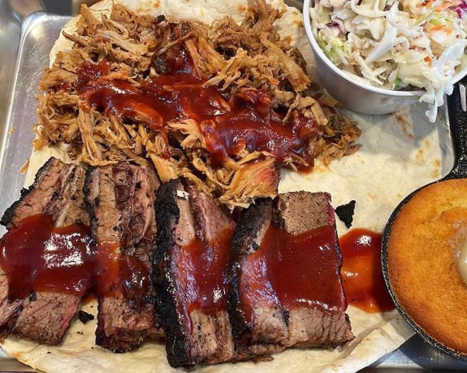 Brisket and pulled pork sharing a plate like old friends, with coleslaw playing peacekeeper between these smoky rivals.