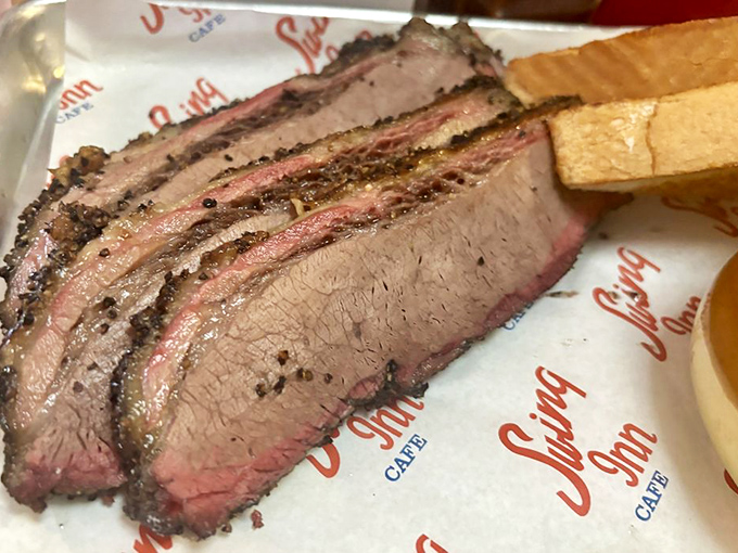 Brisket so perfectly smoked it makes you wonder if they've somehow bent the laws of physics and flavor.