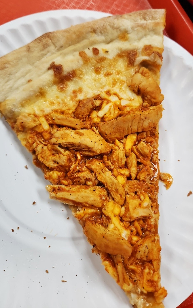 Buffalo chicken pizza: where New York and Buffalo had a delicious love child. That generous portion of chicken makes this slice a meal in itself.