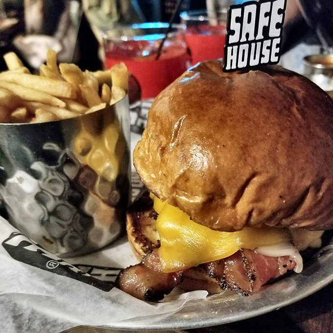 A burger so good it needs its own security detail. That melty cheese and bacon combo is classified information your stomach deserves to know.