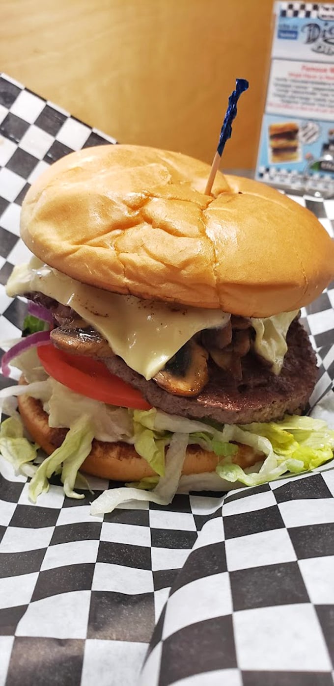This isn't just a burger; it's architecture. Layers of fresh vegetables, melted cheese, and a perfectly grilled patty create the skyscraper of satisfaction.