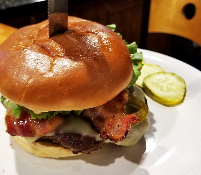 This isn't just a burger&mdash;it's architectural perfection between buns, where every layer plays its part in the flavor symphony.