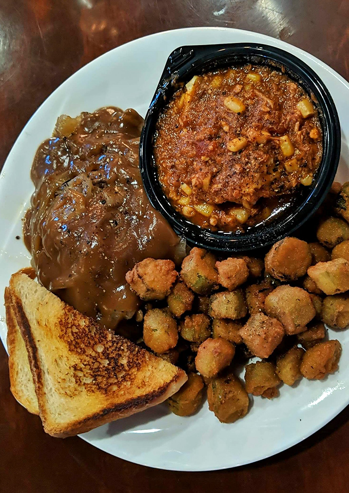 Comfort on a plate&mdash;juicy burger steak smothered in rich gravy, with crispy okra and creamy mac and cheese that tastes like home.