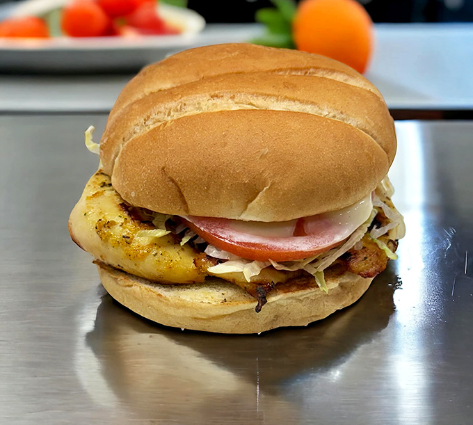 The chicken sandwich arrives dressed for success with fresh veggies that add both crunch and color.