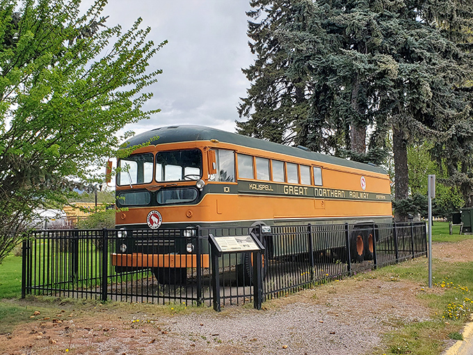 This vintage Great Northern Railway bus represents an era when "all aboard" meant the start of a mountain adventure, not just a social media notification.