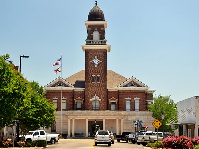 The Butler County Courthouse gleams in the Alabama sunshine, its clock tower keeping time for a community that values tradition as much as tomorrow.