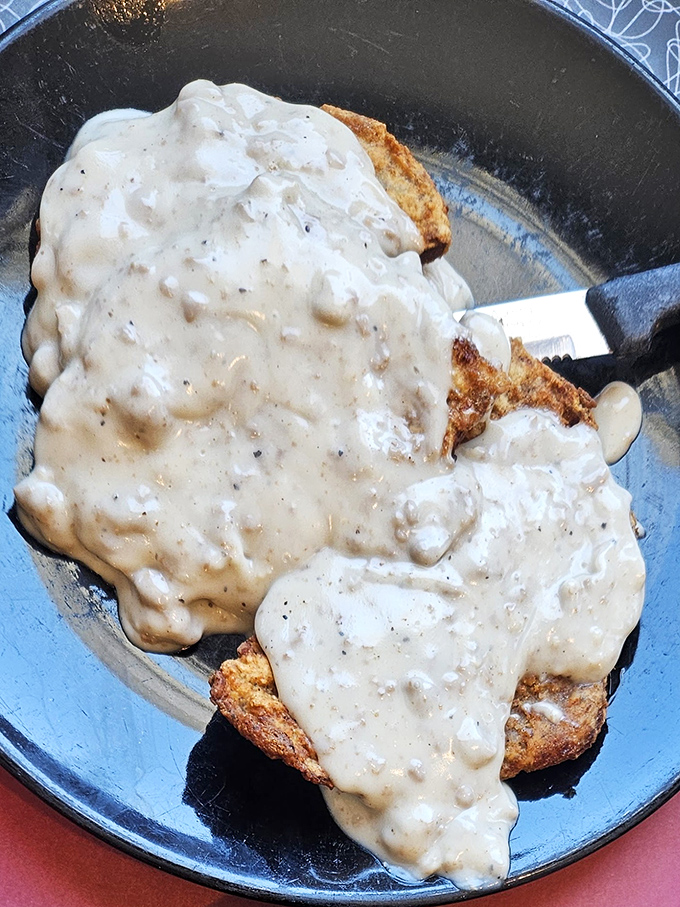 Biscuits and gravy &ndash; the holy grail of diner food. This creamy, peppery masterpiece clings to each bite like it was made for this purpose.