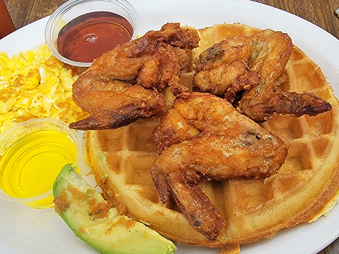 The legendary chicken and waffles&mdash;where crispy, golden-brown perfection meets maple-drenched waffle in a harmony that makes you question why we ever eat them separately.