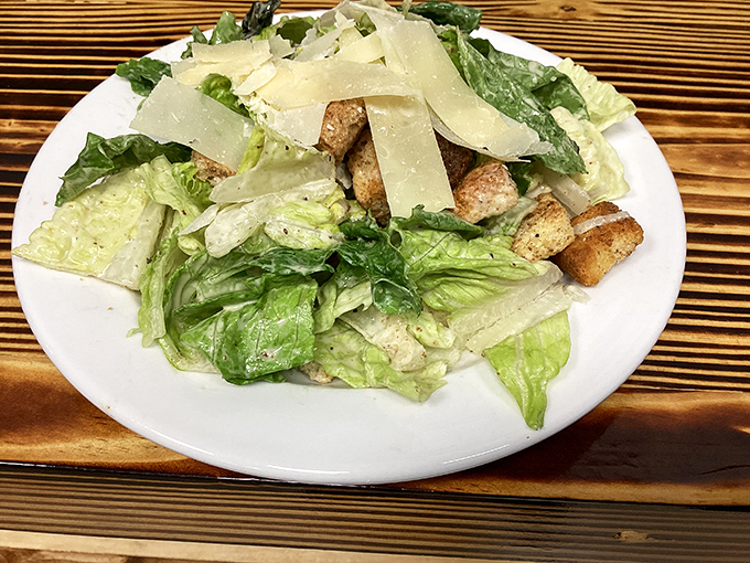 A Caesar salad that Julius himself would approve of. Crisp romaine, house-made croutons, and shaved parmesan that doesn't come from a green can.