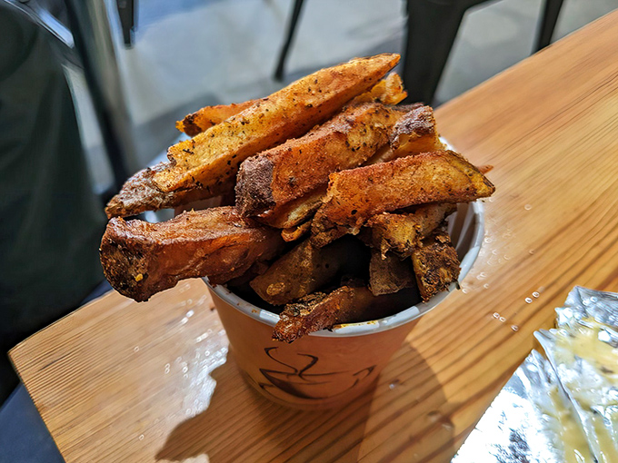 These aren't just fries; they're crispy potato pillars of joy, seasoned with what can only be described as "why-aren't-all-fries-this-good" spice.