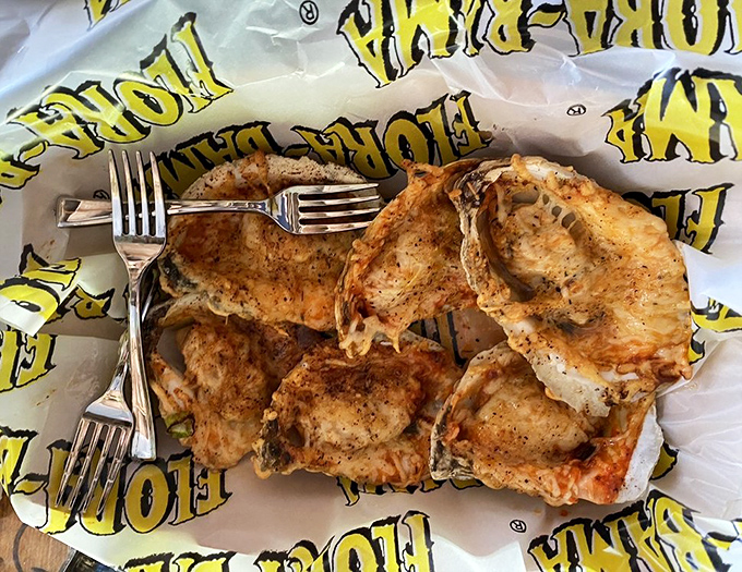 These char-grilled oysters aren't just food; they're a religious experience that'll have you speaking in tongues of butter and parmesan.