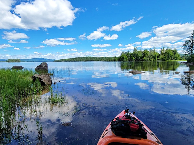 Paddling through postcard perfection &ndash; where your kayak becomes a magic carpet hovering between twin worlds of sky and water.