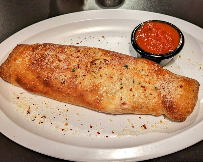 This calzone isn't just a meal&mdash;it's an event. Perfectly bronzed exterior giving way to a steamy interior that demands to be photographed before consumption.
