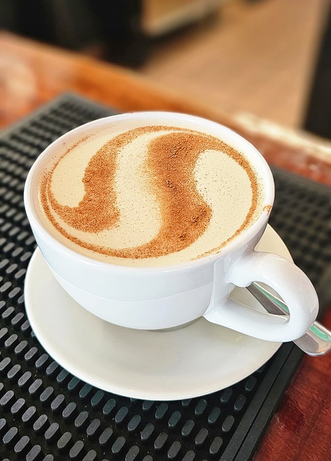 Coffee art that belongs in a museum, not just your stomach. This cinnamon-dusted masterpiece demands a moment of appreciation before sipping.