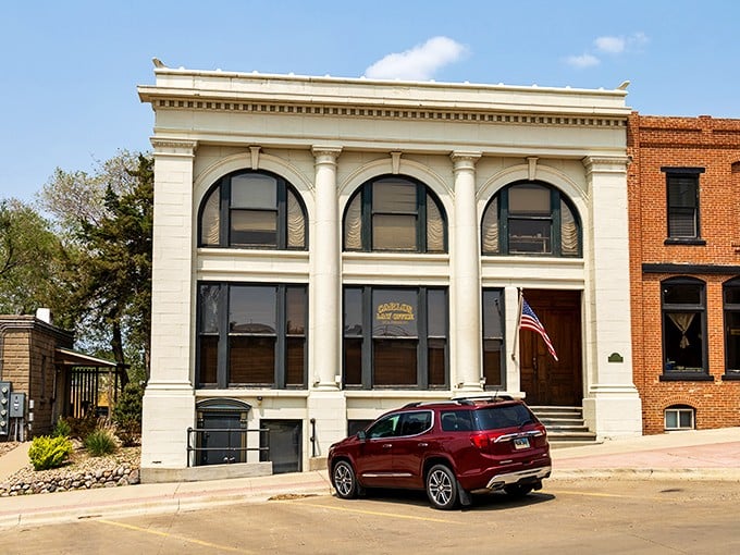 The stately Carlon Law Office building whispers tales of frontier justice with its classical columns and timeless architecture.