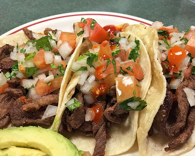 These street-style tacos don't need fancy plating to impress. The carne asada speaks for itself, topped with the holy trinity of onion, cilantro, and fresh salsa. 