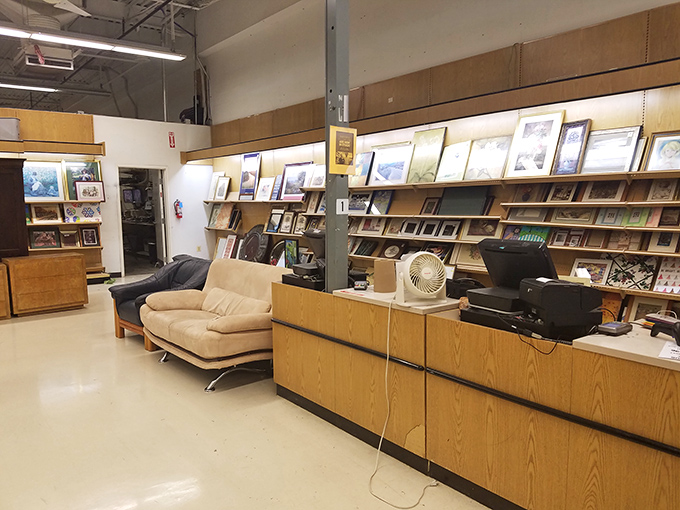 The checkout area at UNIQUE doubles as a treasure gallery, with picture frames and furniture waiting to find their forever homes.