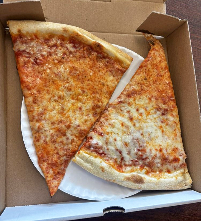 The mark of a great pizzeria isn't complexity but mastering simplicity&mdash;these cheese slices are proof that perfection needs no embellishment.