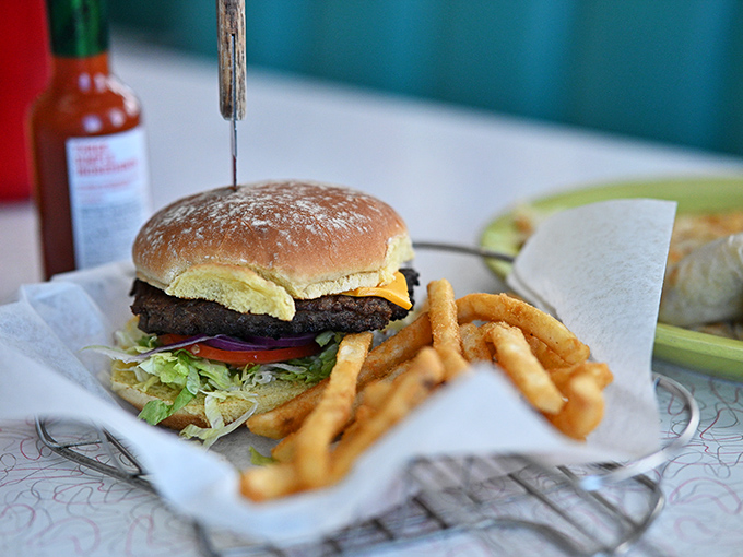 A classic cheeseburger served with golden fries&mdash;proof that sometimes the simplest pleasures are the most satisfying, especially after miles of desert highway.