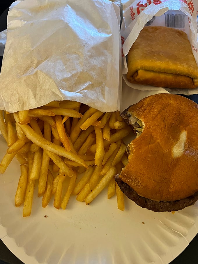 Golden fries and a juicy burger - the supporting cast that deserves a standing ovation. Simple food done right never goes out of style.