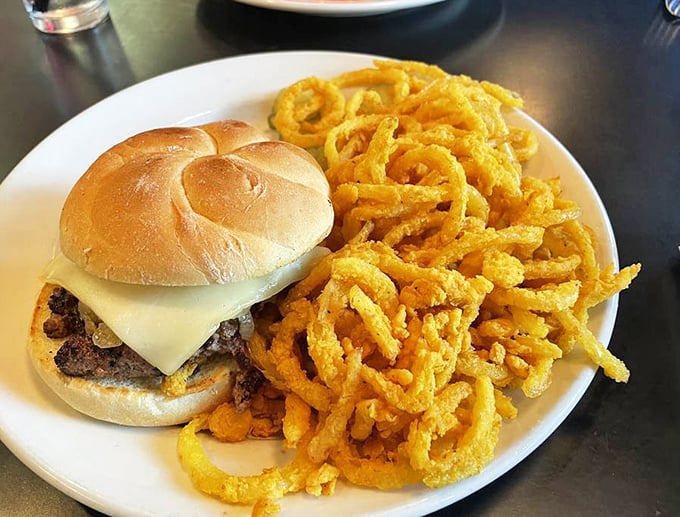 This isn't just a cheeseburger&mdash;it's a masterpiece with a supporting cast of crispy onion rings that deserve their own standing ovation.