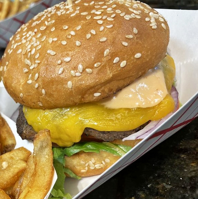 This isn't just a cheeseburger; it's edible architecture. The melty cheese cascades over the patty like a yellow waterfall of happiness.