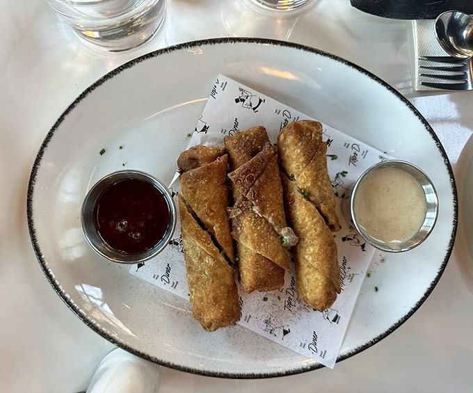 Not your grandmother's appetizer. These cheesesteak egg rolls brilliantly marry Philadelphia tradition with innovative presentation, served with dipping sauces worth fighting over.