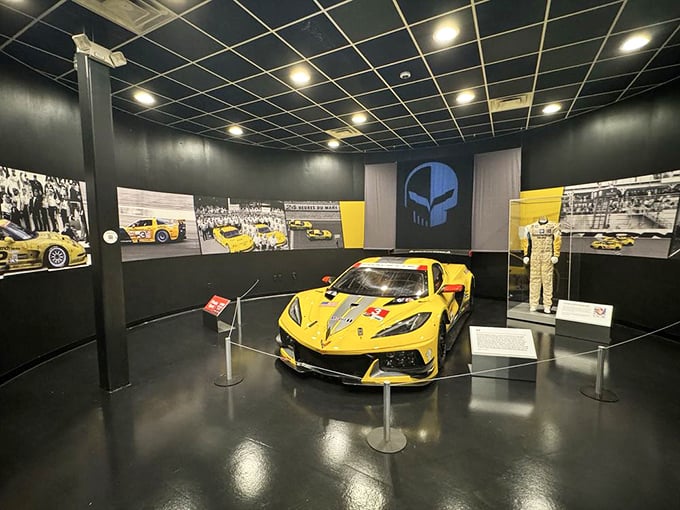 The racing exhibit's C8.R showcases Corvette's competitive spirit, with its menacing yellow paint scheme and aerodynamics that practically snarl "get out of my way."