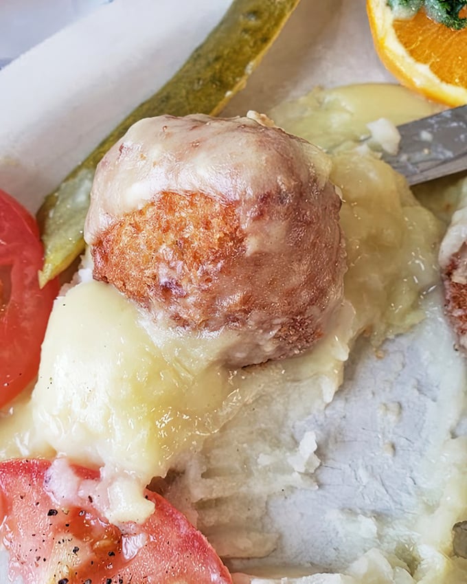 Chicken croquettes swimming in gravy &ndash; comfort food that whispers, "Everything's going to be alright" with each bite.