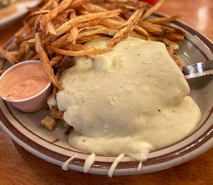 Comfort food disguised as art—hand-cut fries and creamy gravy that would make a French chef secretly jealous while publicly claiming superiority.