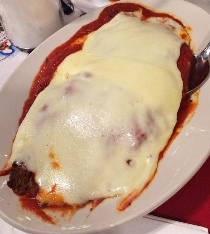 Chicken parmigiana that achieves the impossible trifecta: crispy exterior, juicy interior, and cheese melted to golden perfection.