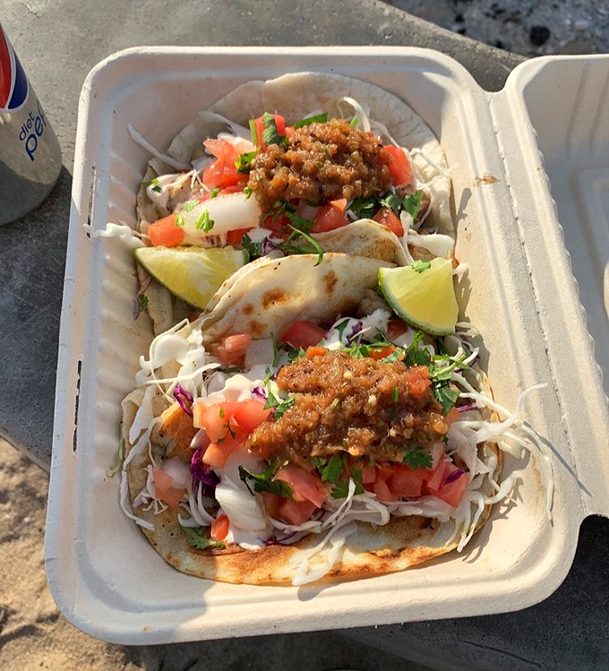 Taco Tuesday any day: these street-style beauties come loaded with fresh cabbage, pico de gallo, and a squeeze of lime &ndash; beach food elevated.