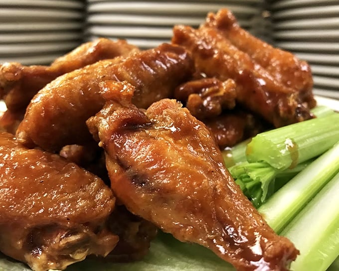These aren't just wings; they're crispy vessels of flavor that demand to be devoured. The celery sticks are just there for moral support.