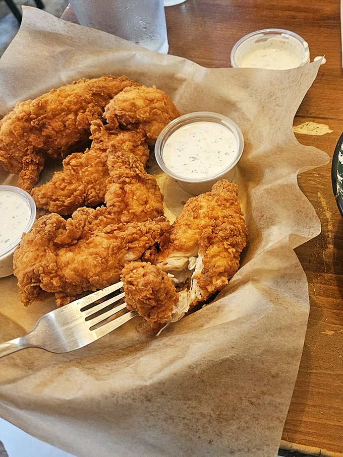These aren't just chicken strips&mdash;they're crispy, juicy masterpieces that make you wonder if chickens in Kansas have special superpowers.