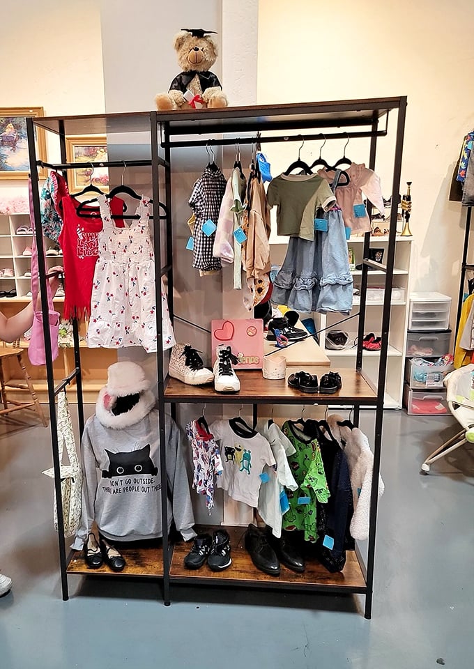 The children's section: where tiny graduation bears preside over fashion for the playground runway. That "Don't Go Outside" sweatshirt speaks parental truth!