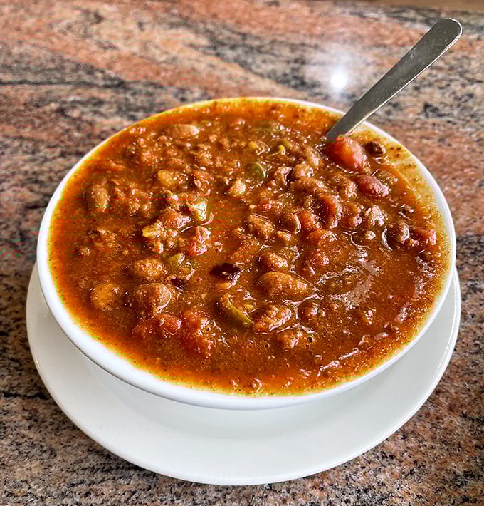 The chili arrives like a warm hug in a bowl, hearty enough to fortify Kentucky coal miners yet refined enough for Louisville's most discerning palates.