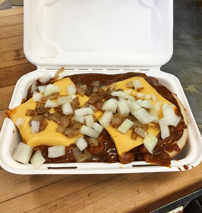 Chili, cheese, onions, and a burger that's hiding underneath it all like a delicious treasure waiting to be discovered. Napkins required, regrets impossible.