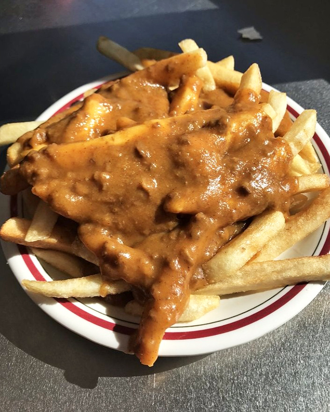 Chili cheese fries that don't care about your diet plans—a glorious mess of comfort that's worth every napkin you'll need afterward.