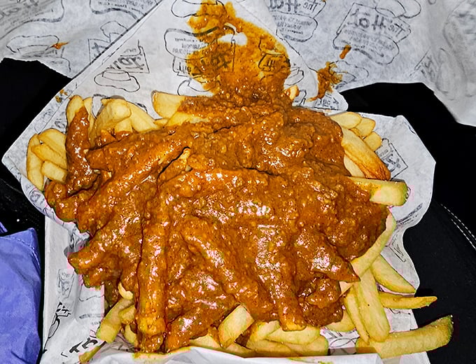 Chili cheese fries that require a game plan and possibly a support group. Worth every delicious, messy bite.