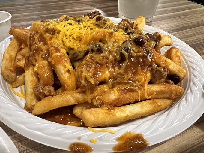 Chili cheese fries that laugh in the face of diet plans&mdash;a glorious mess of crispy potatoes, savory chili, and cheese that stretches like it's training for the Olympics.