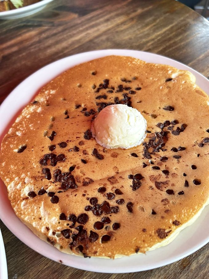 A chocolate chip pancake that doesn't just satisfy hunger&mdash;it sparks joy. That melting butter pat is performing sacred breakfast alchemy.