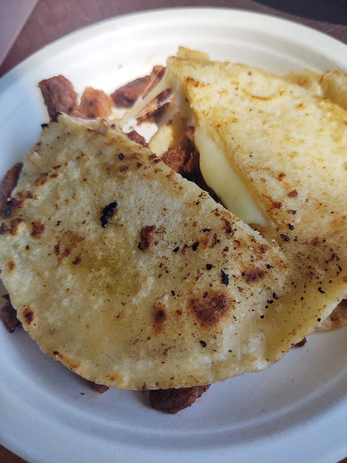 The quesadilla that launched a thousand sighs &ndash; perfectly grilled tortilla embracing melted cheese and chorizo like they were meant to be together all along.