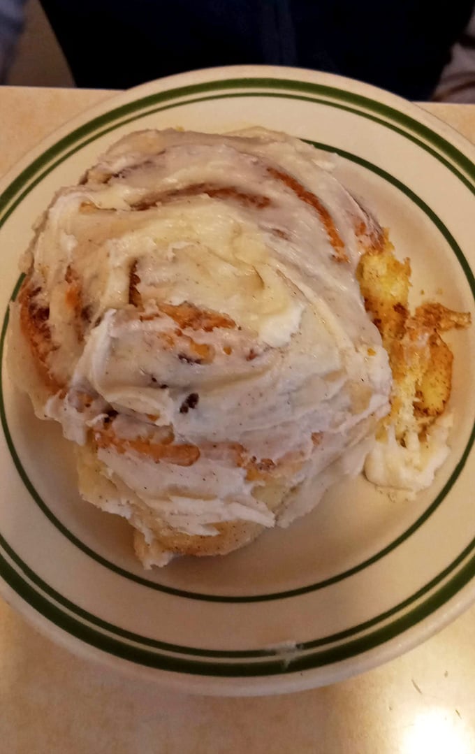Cinnamon roll or work of art? The icing melts into every warm, spiced crevice like it's finding its way home.
